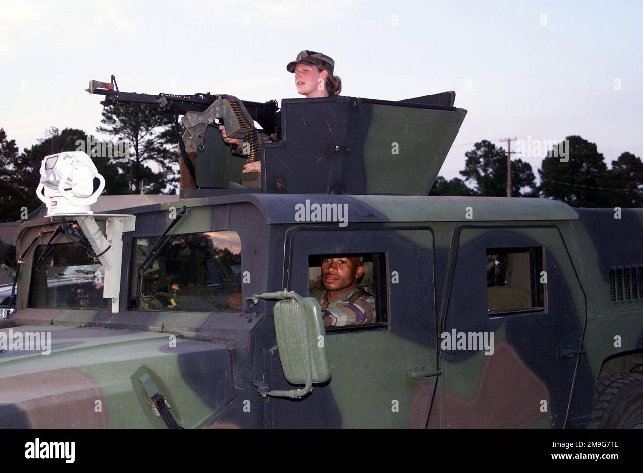 US Air Force SENIOR AIRMAN Jenkins (top), armed with an M60 machine gun ...