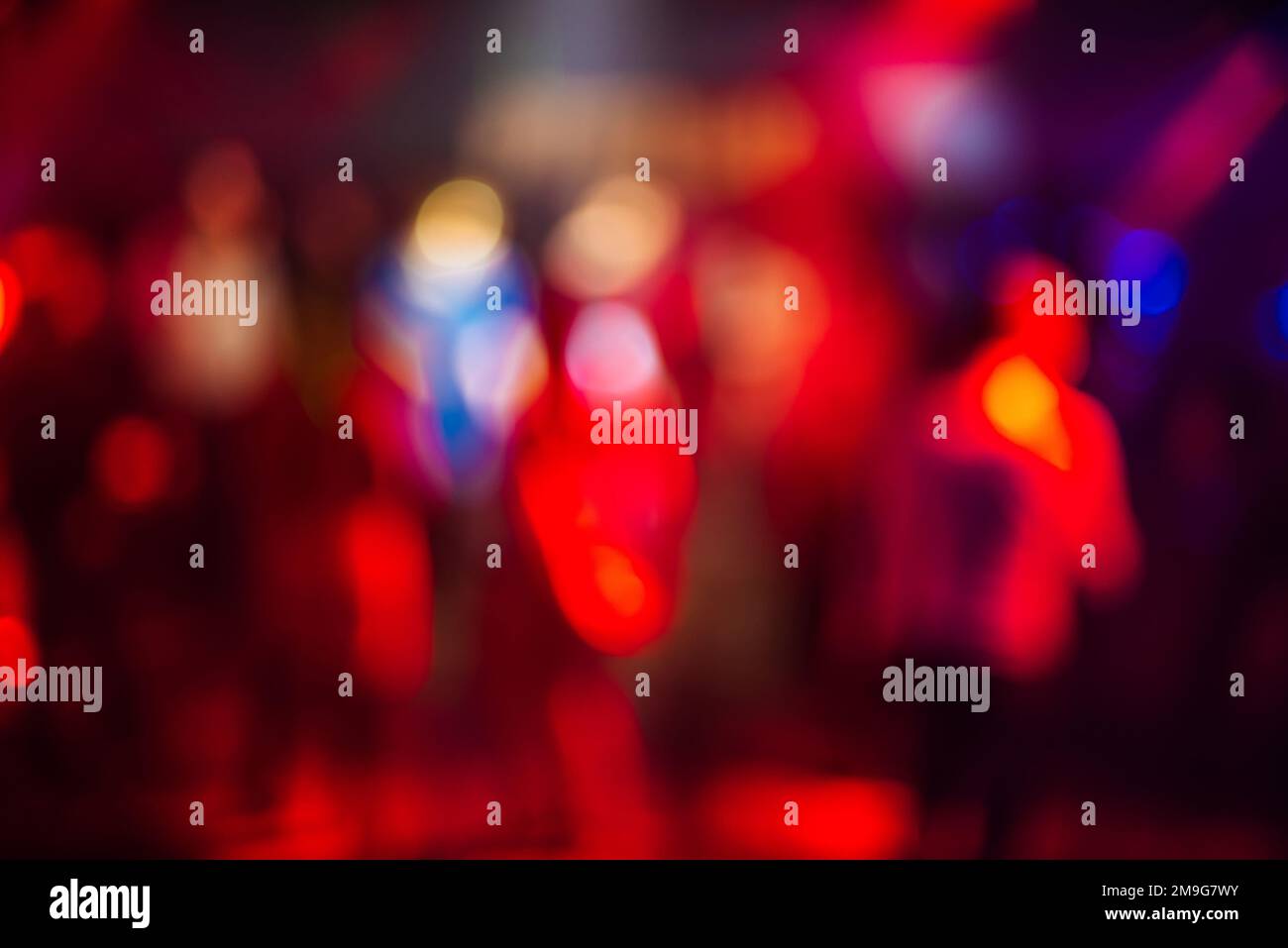 multicolored blurred background with bright red bokeh Stock Photo - Alamy