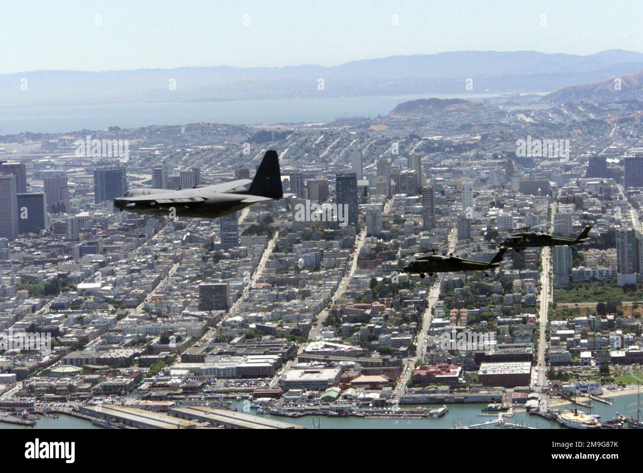 A MC-130 Combat Shadow tanker and two HH-60G Pavehawk helicopters from ...