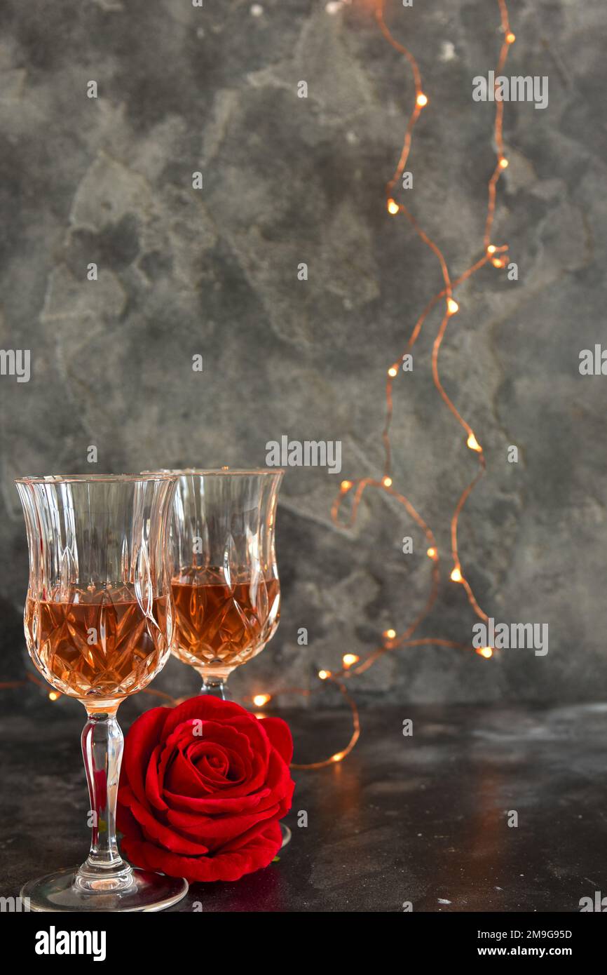 Close up two glasses of liquor and a rose on a black background Stock ...