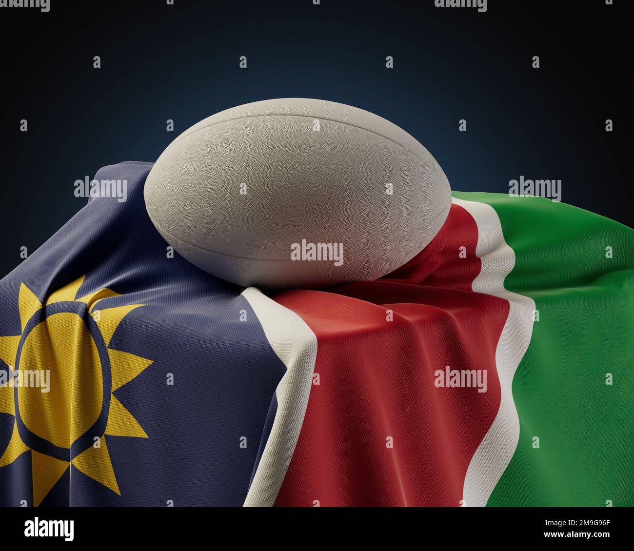 A regular rugby ball resting on a Namibia flag draped over a plinth on ...