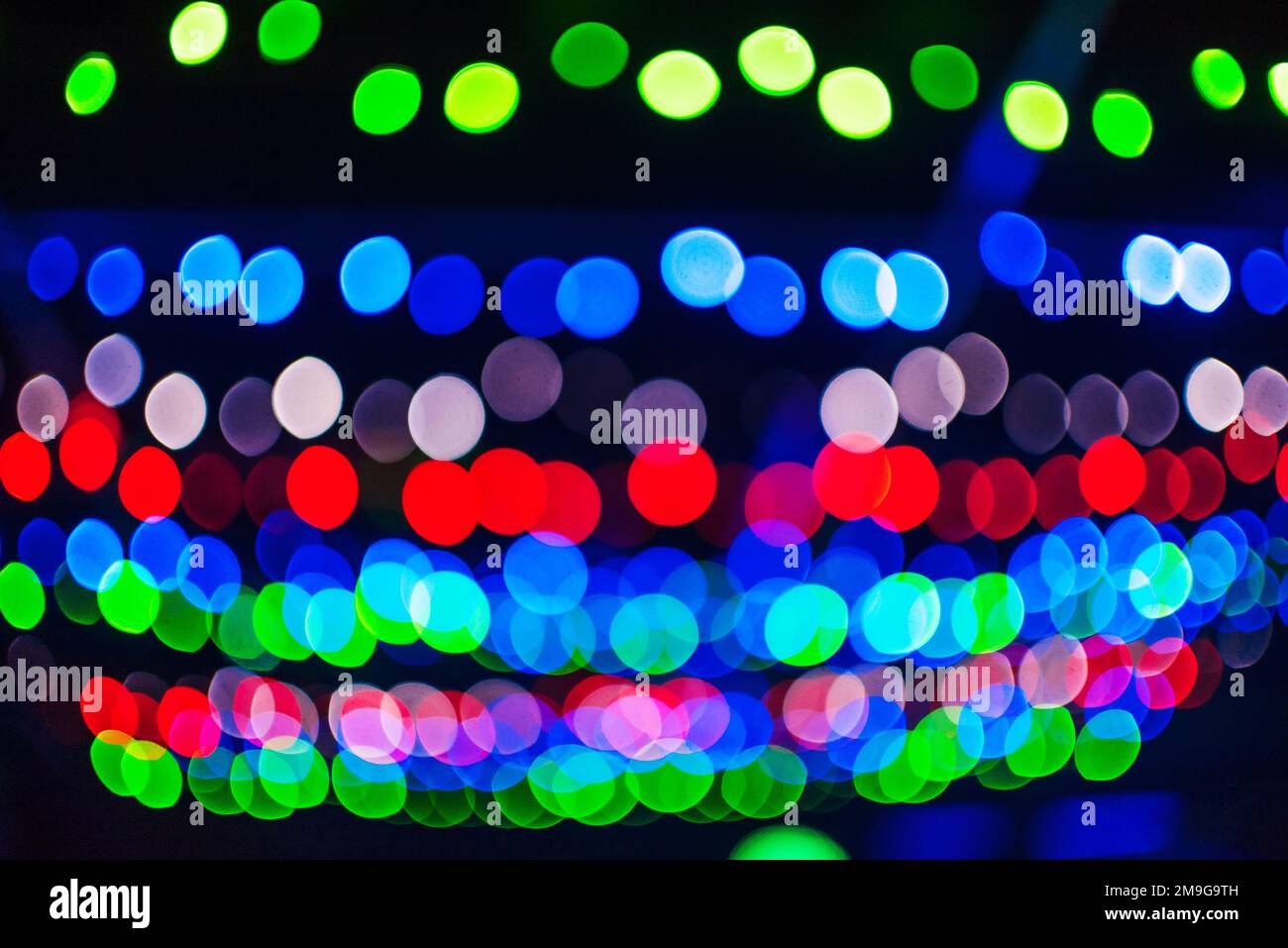 abstract blurred bright color background with bokeh from Christmas ...