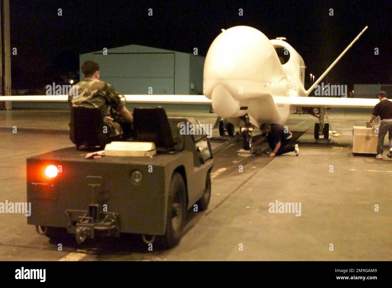 The Global Hawk unmanned aircraft is weighed and systems checked after ...