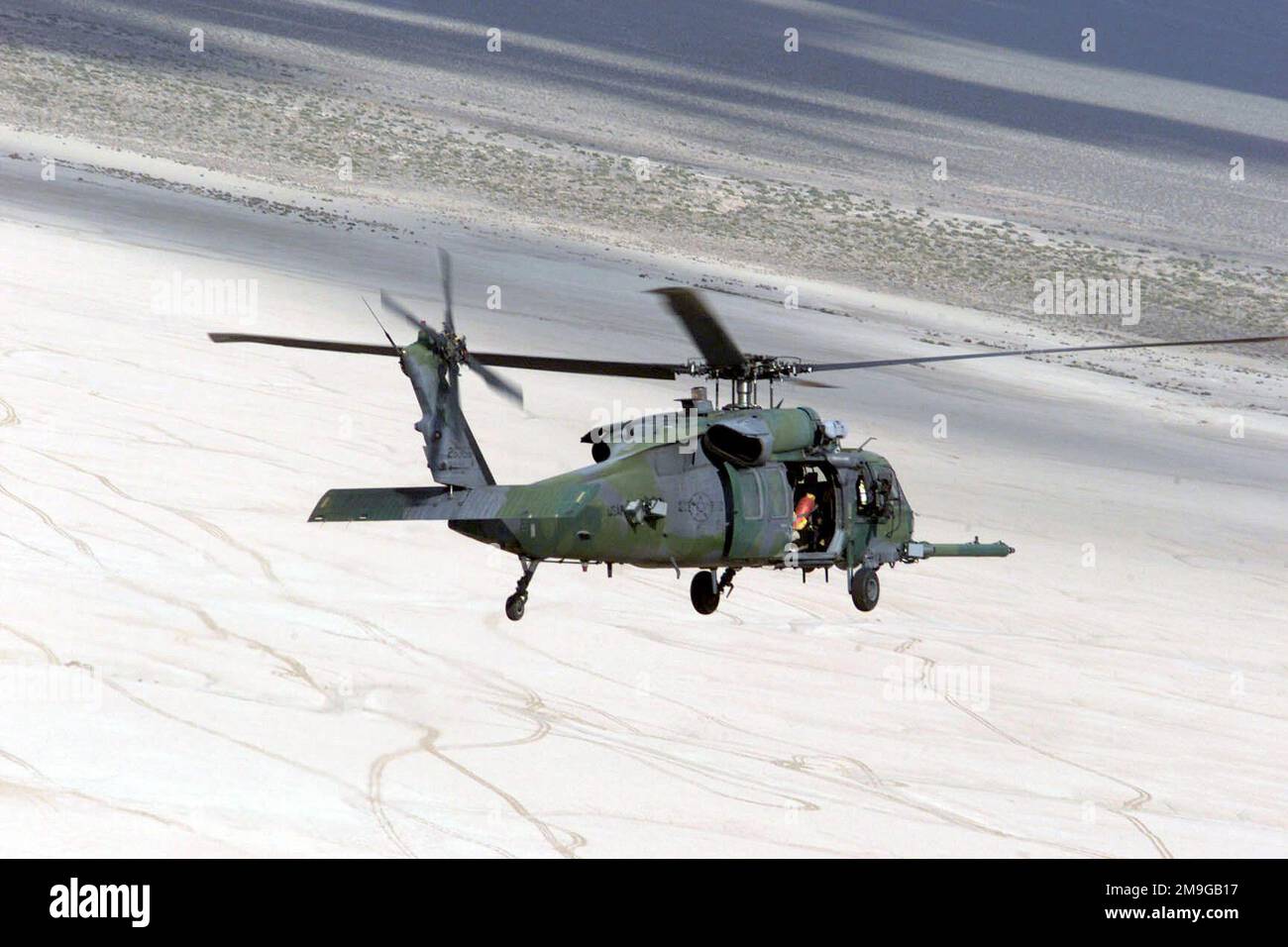 An HH-60G Pave Hawk helicopter from the 41st Rescue Squadron flies over ...