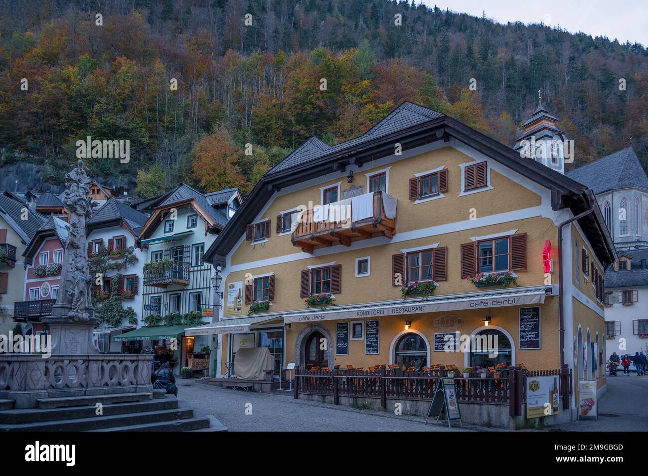 Hallstatt, Austria. View of a central street with colorful wooden ...