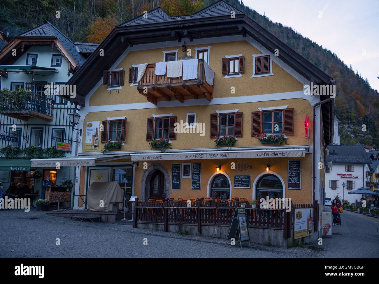 Hallstatt, Austria. View of a central street with colorful wooden ...