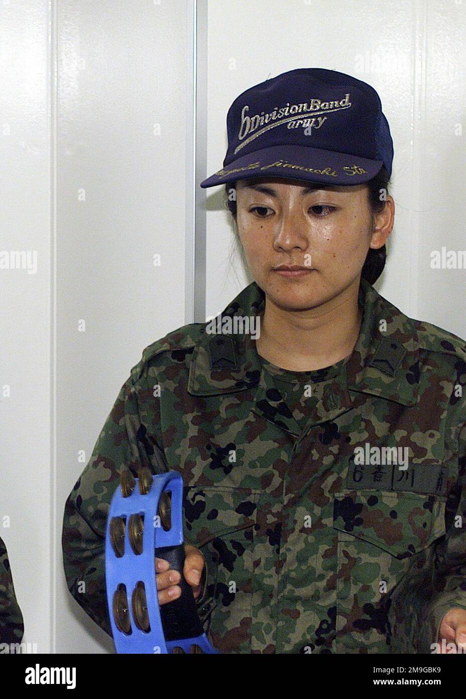 Japanese Ground Self Defense Force Soldier plays the tamborine in the ...