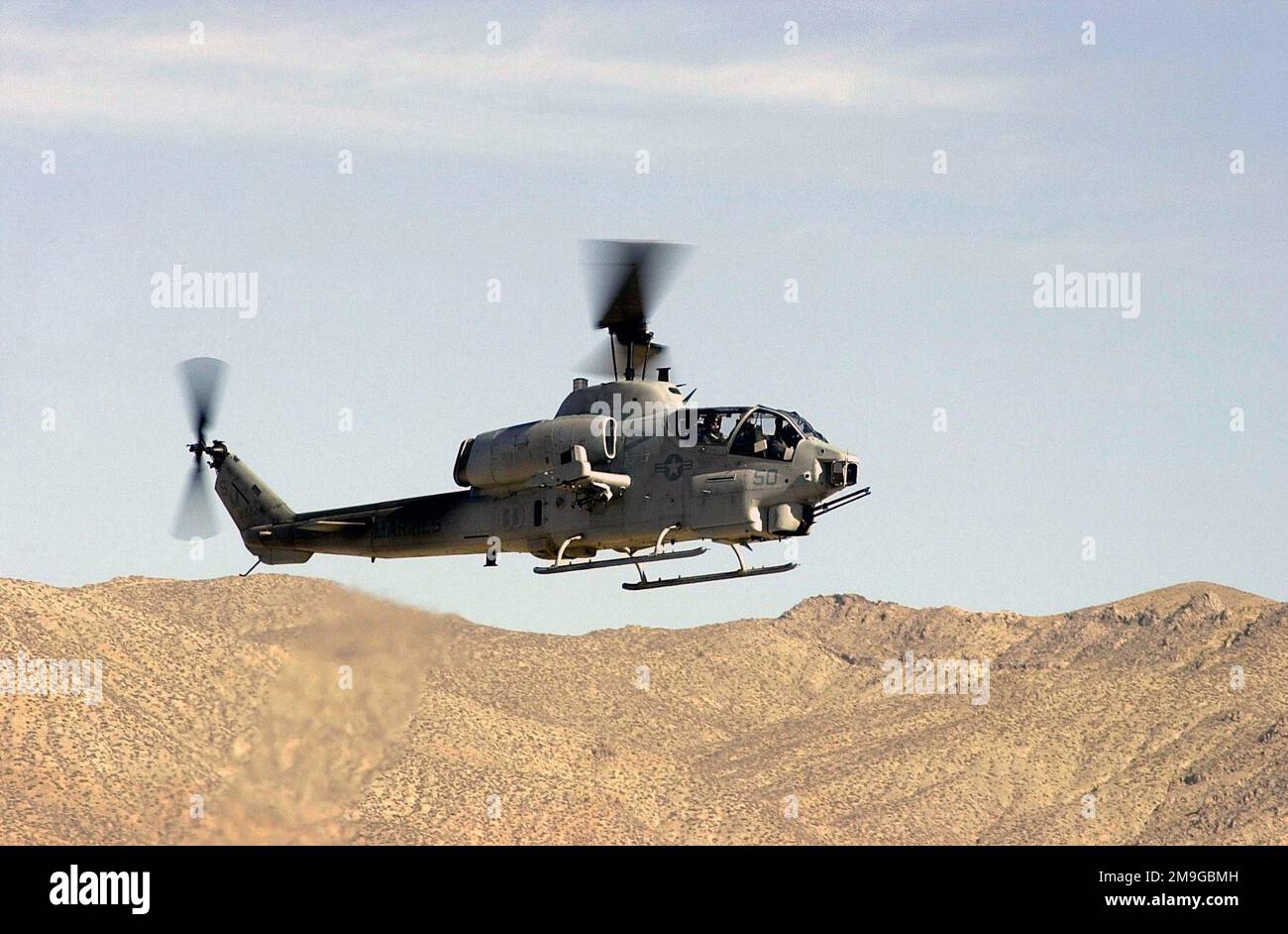 A Marine UH-1 Cobra heads back to home station after hitting a ...