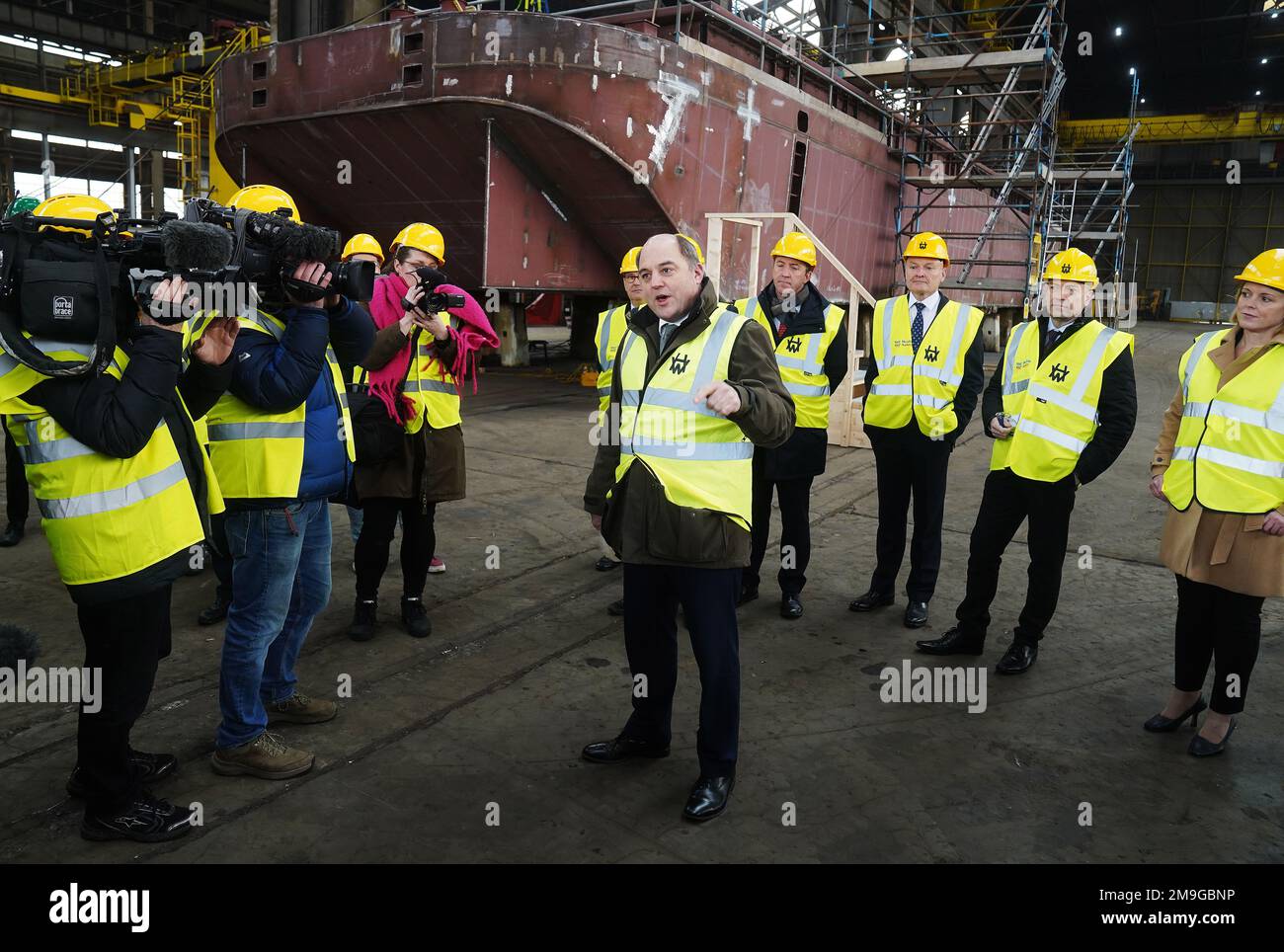 Defence Secretary Ben Wallace (centre) during a visit to Harland ...