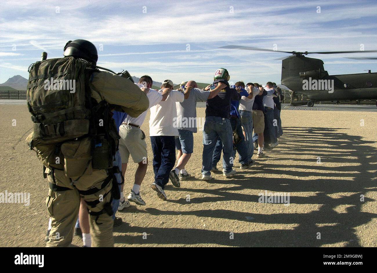 Rescue forces transport freed detainees to a waiting CH-47 Chanook ...