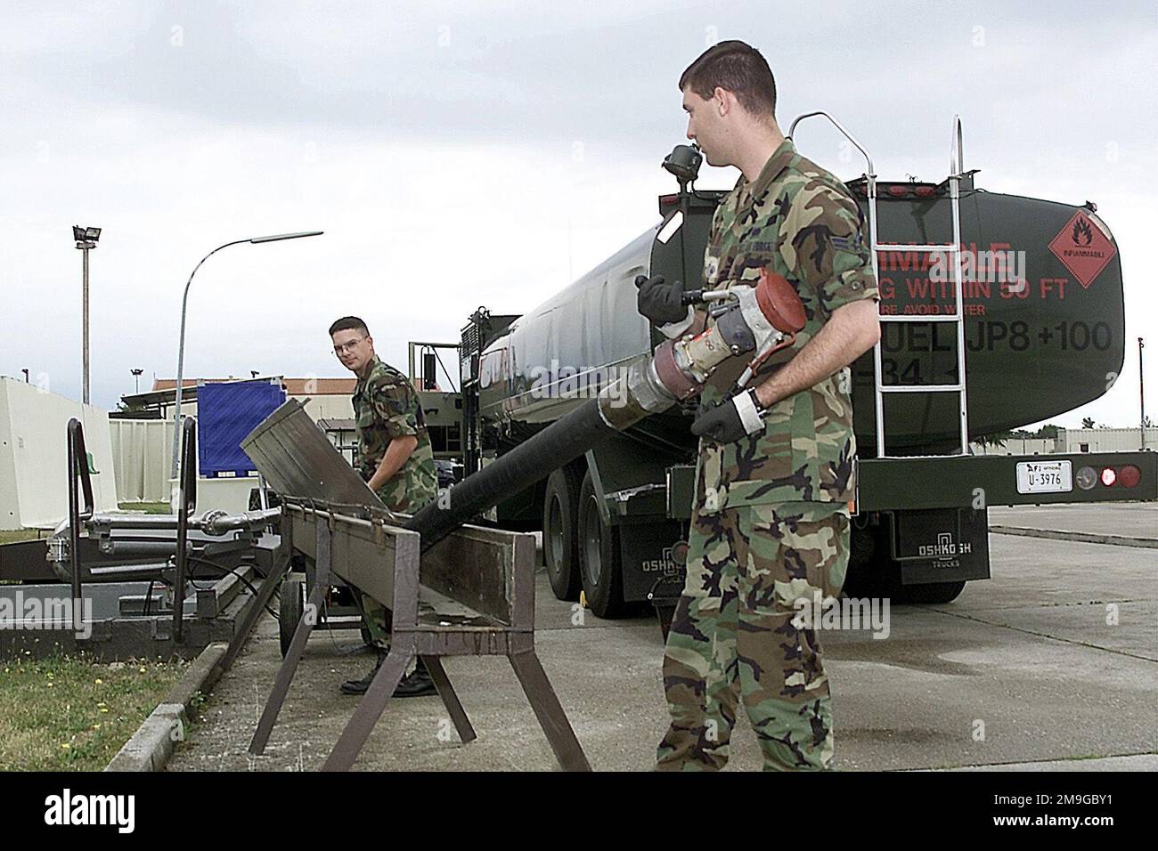 AIRMAN First Class Brandon Wedmore (foreground) and STAFF Sergeant Ken ...