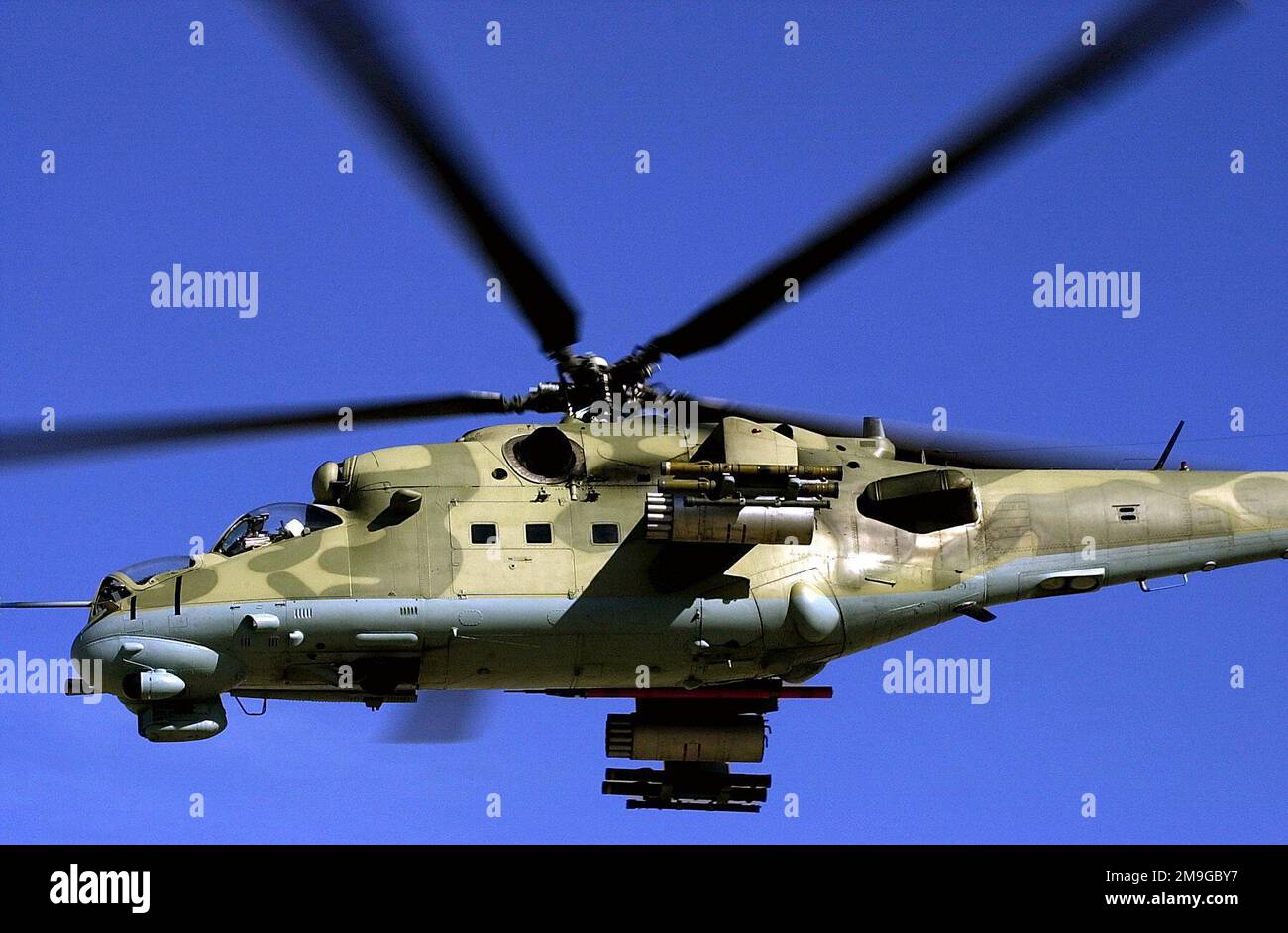 A MI-24 Hind helicopter moves in as an aggressor during a Non-Combatant ...