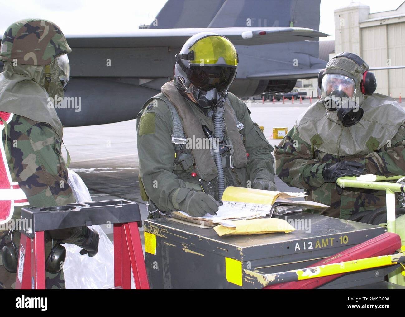 Personnel from the 12th Fighter Squadron complete necessary paperwork ...