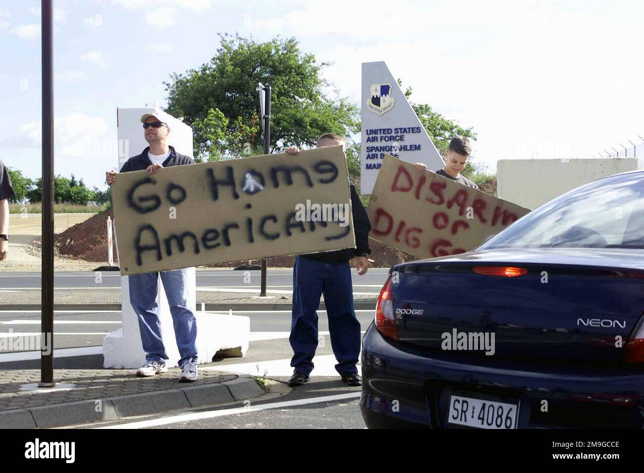 Protesters stage a mock protest against Americans during an Anti ...