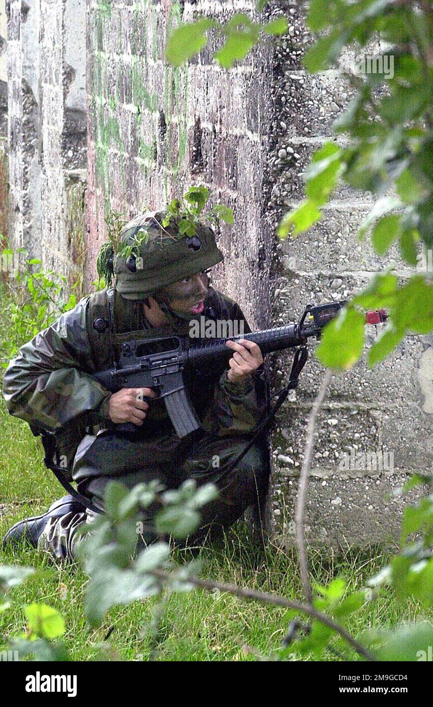 AIRMAN Sheri Alementi takes a defensive posture as her team attempts to ...