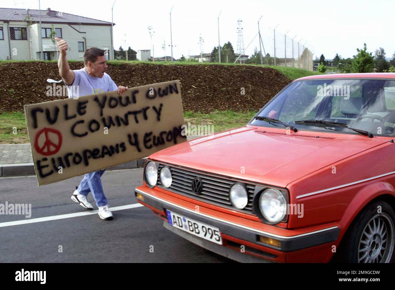 Jody T. Hawk, a "protester", tries to stop a car from entering the main ...