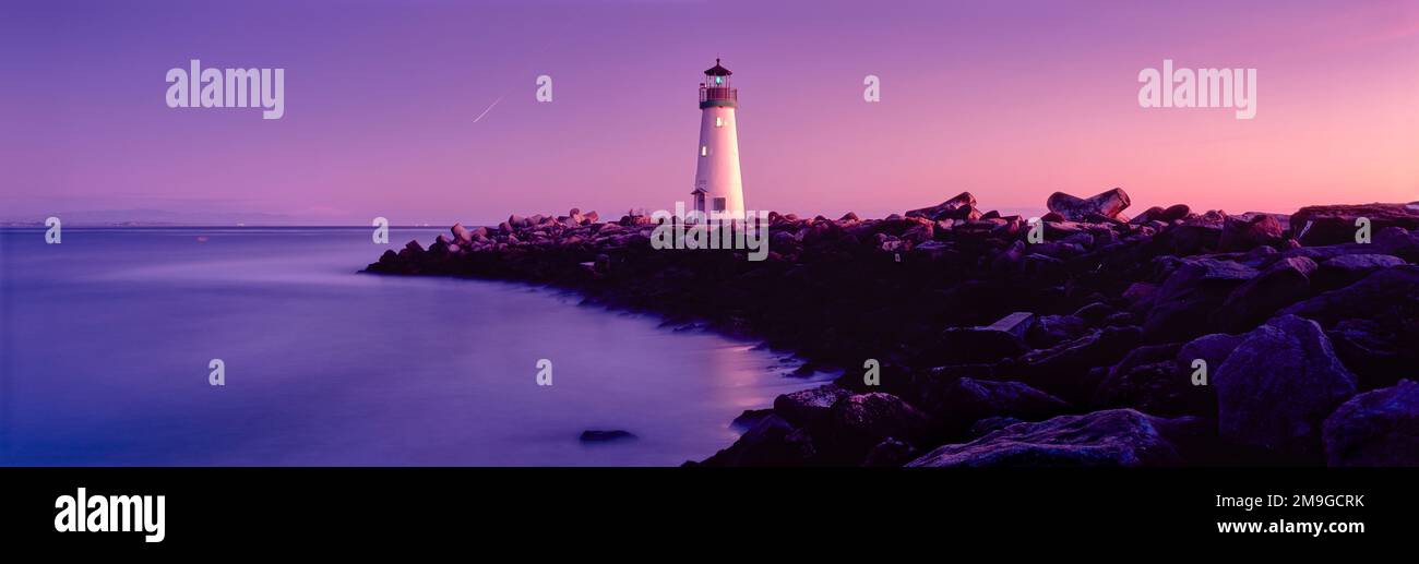 Walton Lighthouse on shore of Pacific Ocean at sunset, Santa Cruz ...