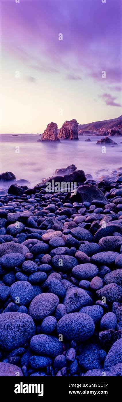 Landscape with pebbles on seashore at sunset, Garrapata State Park, Big ...