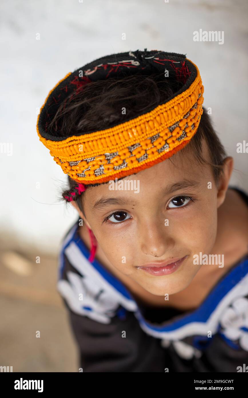 Close-up portrait of a young Kalash girl wearing traditional clothes ...