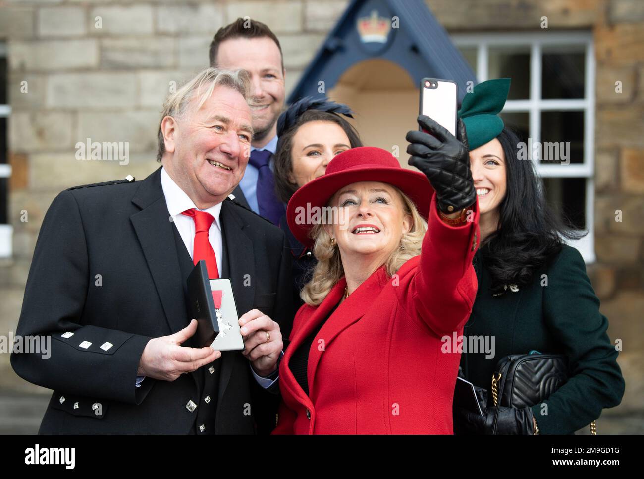 Alan Rough posing for a photo after being made Order of the British ...