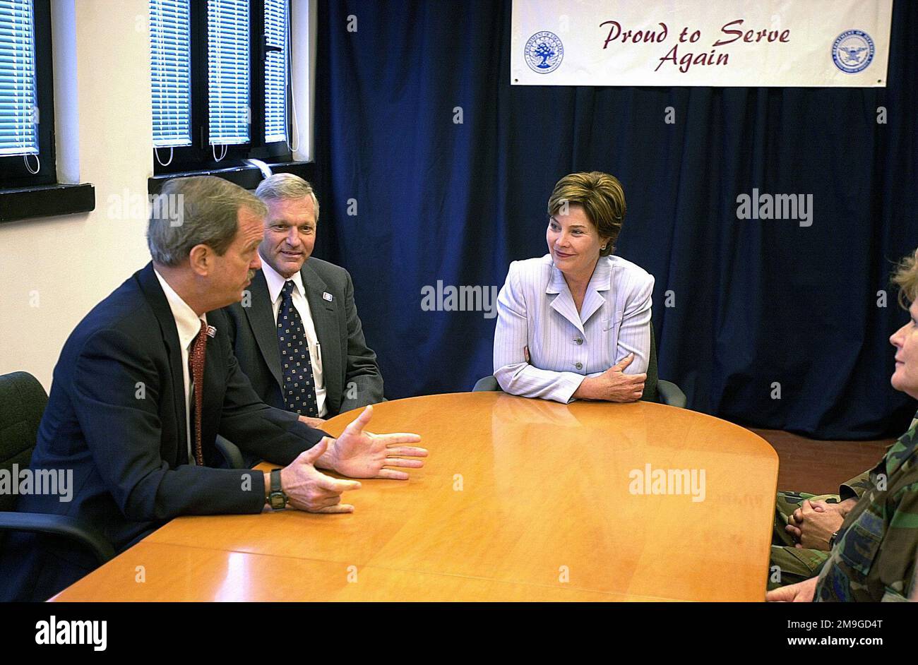 Mrs. Bush and to her immediate right, Dr. John Gantz, Director of ...