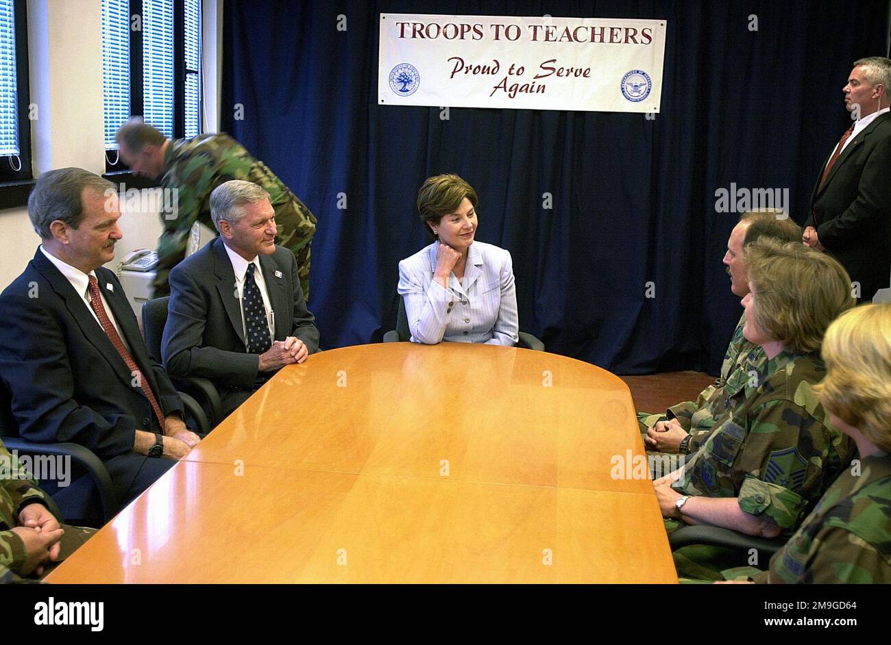 Mrs. Bush and to her immediate right, Dr. John Gantz, Director of ...