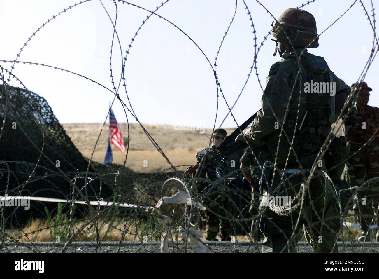Soldiers stand gaurd at the Entry Control Point at this years GOLDEN ...