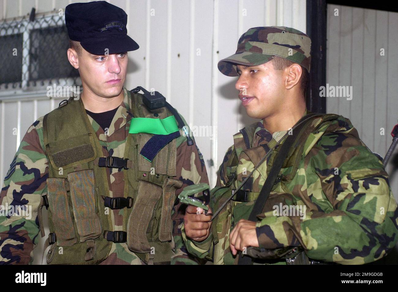 STAFF Sergeant Robert Kochan teaches AIRMAN Florencio Olivares how to ...