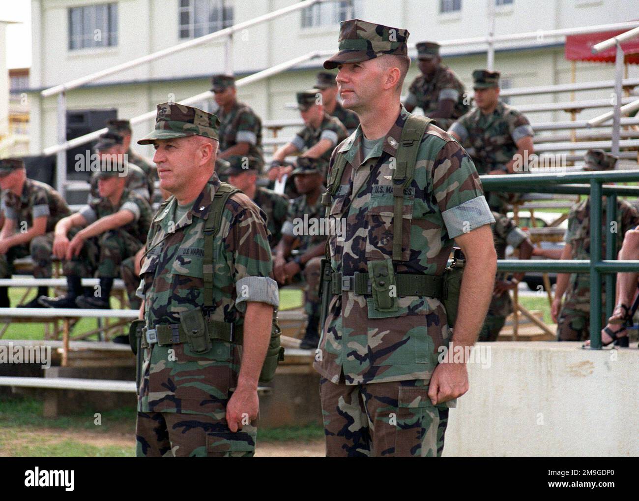 Lieutenant Colonel (LTCOL) McGee and LTCOL Cross await the delivery of ...