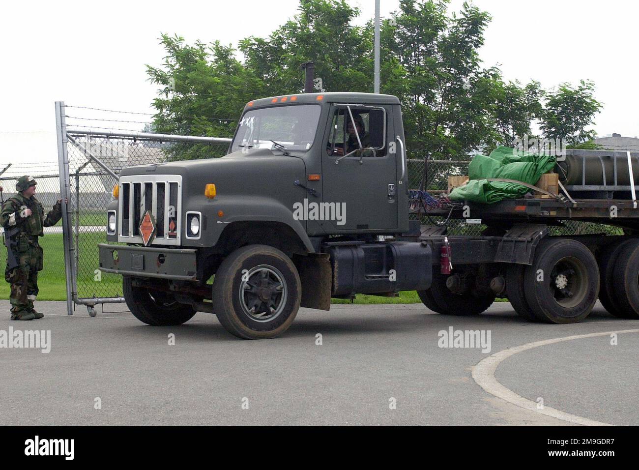 SENIOR AIRMAN Albert Weaver 51st MXS allows a tractor trailer of bomb ...