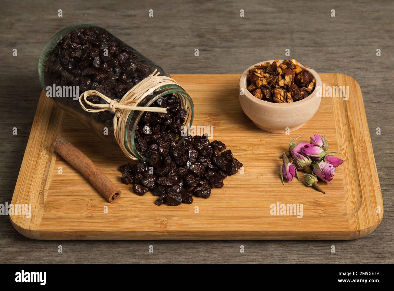 Chocolate grains spilled from the jar Stock Photo - Alamy