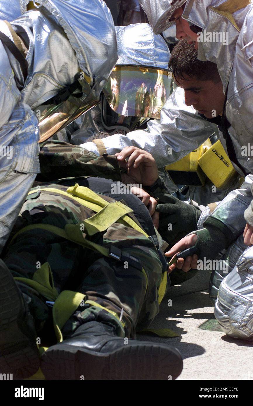 010804-F-9631D-027. [Complete] Scene Caption: A member of the Aircraft ...