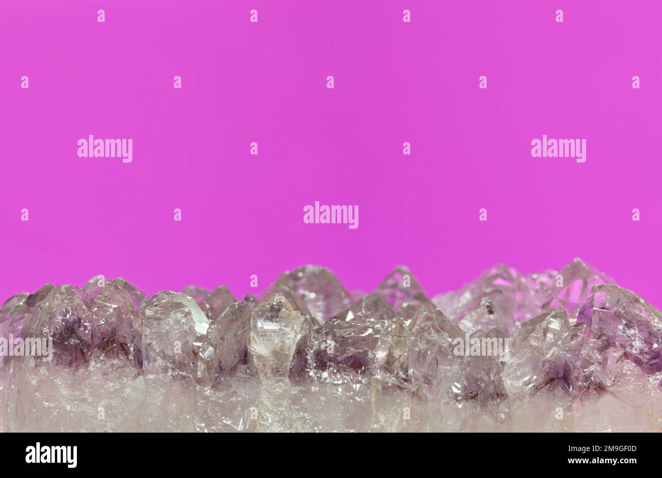 Light pale colored Amethyst quartz crystals in raw mineral form on a ...