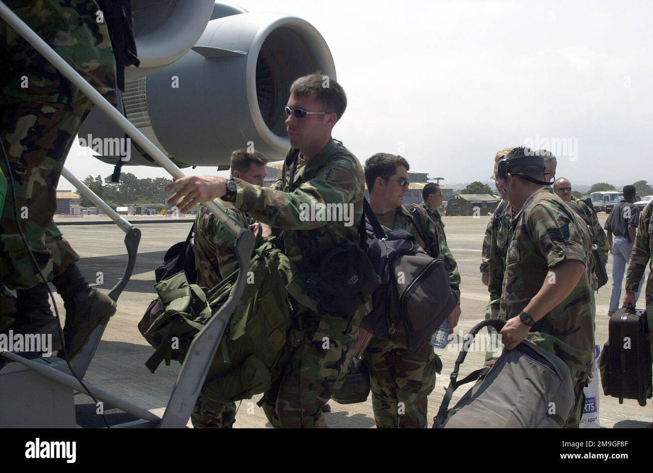 Members of the Army's 3rd Special Forces, board an Air Force C-17 ...
