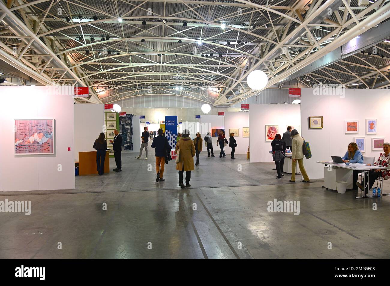 Multiple stands with paintings presented at Artissima vernissage of ...