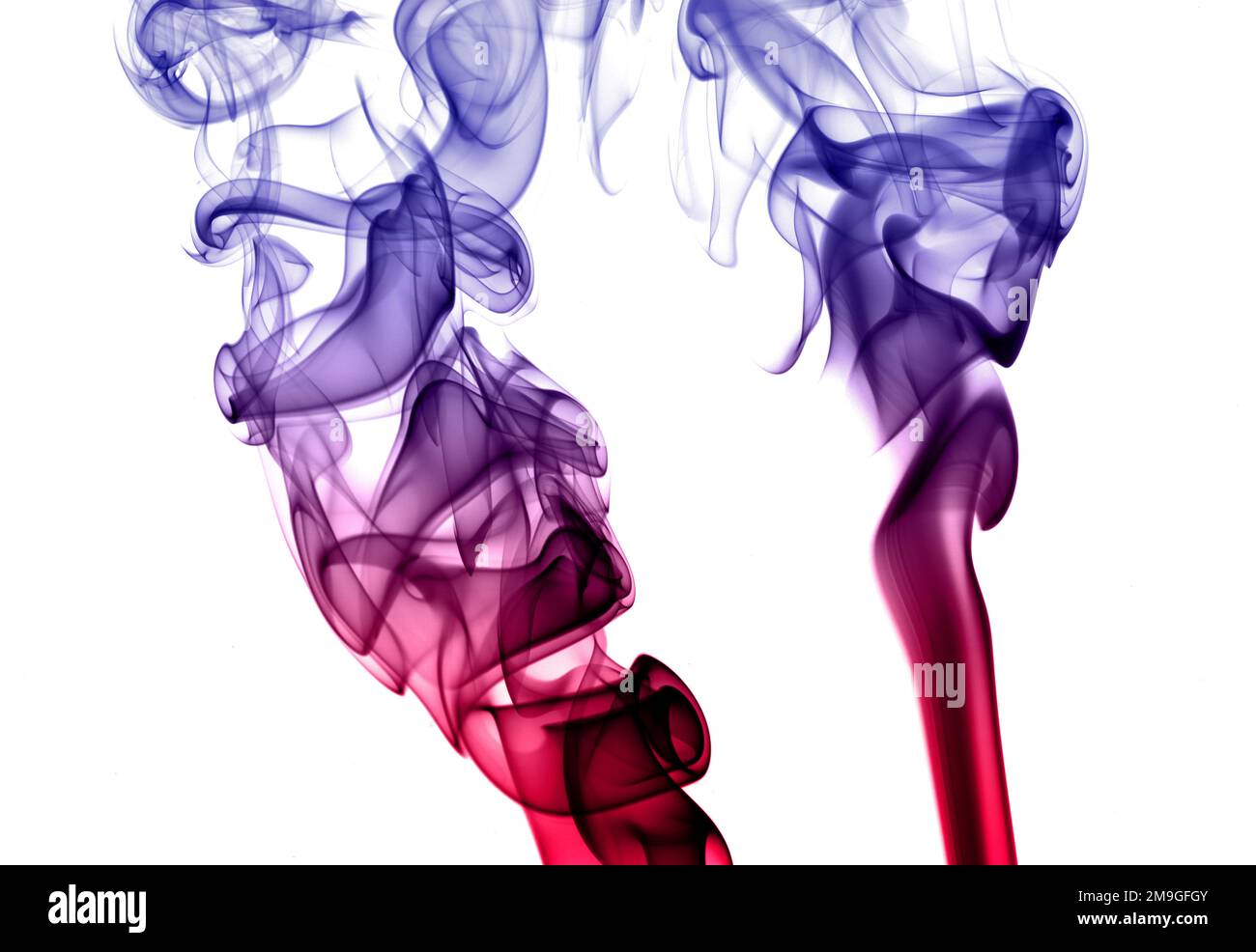Artistic looking smoke swirls photographed against a plain white ...