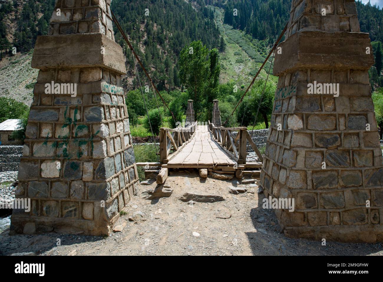 Suspension bridge in Shaikhanandah village, Bumburet Valley, Pakistan ...