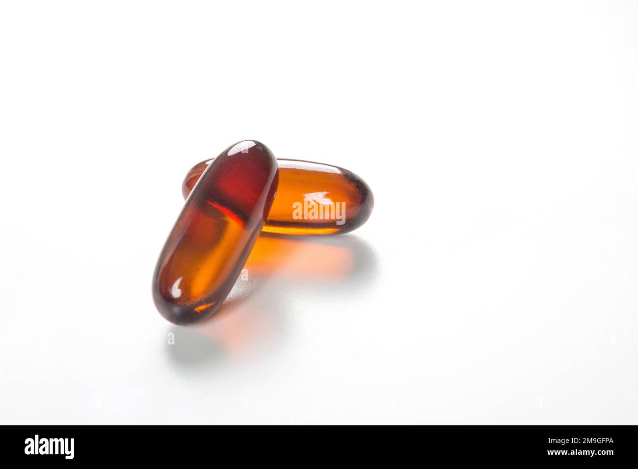 Leptin capsules on white background. Leptin is an appetite reducing ...