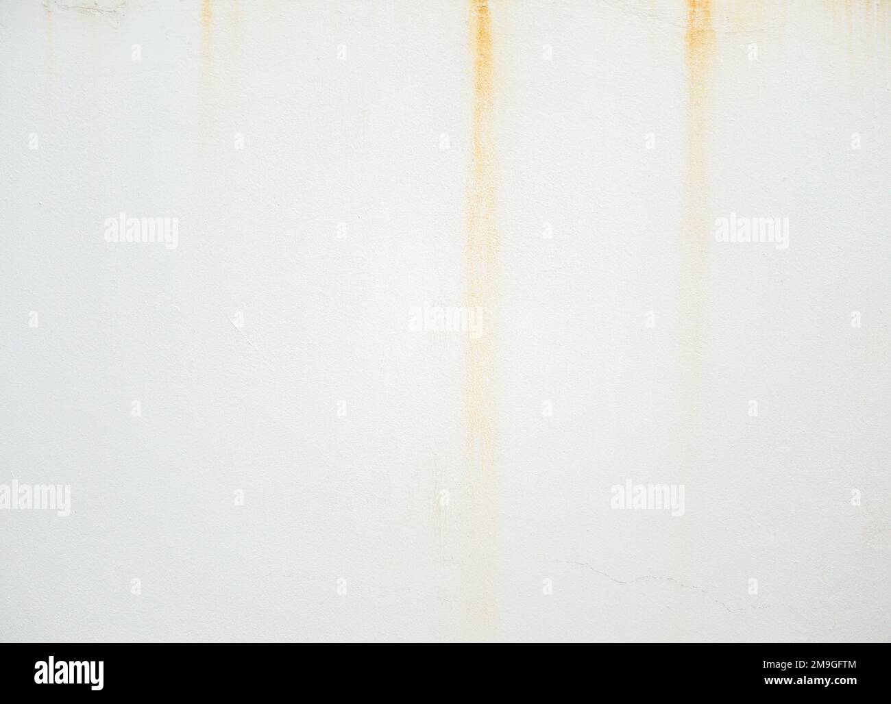 The white concrete wall with the rust stain of the modern house in the ...