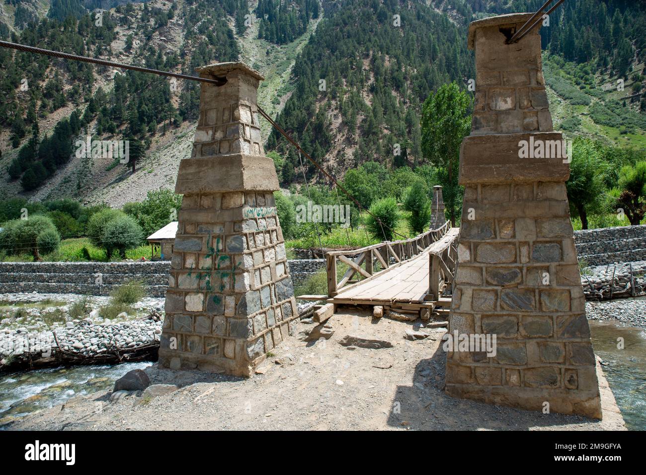 Suspension bridge in Shaikhanandah village, Bumburet Valley, Pakistan ...