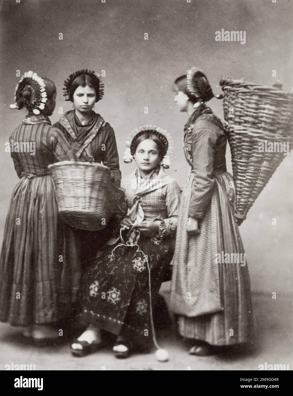 Working class women with baskets, Bellagio, Italy. c,1890 Stock Photo ...