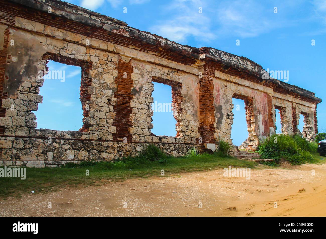 The remainings of the Punta Borinquen Lighthouse against the blue sky ...