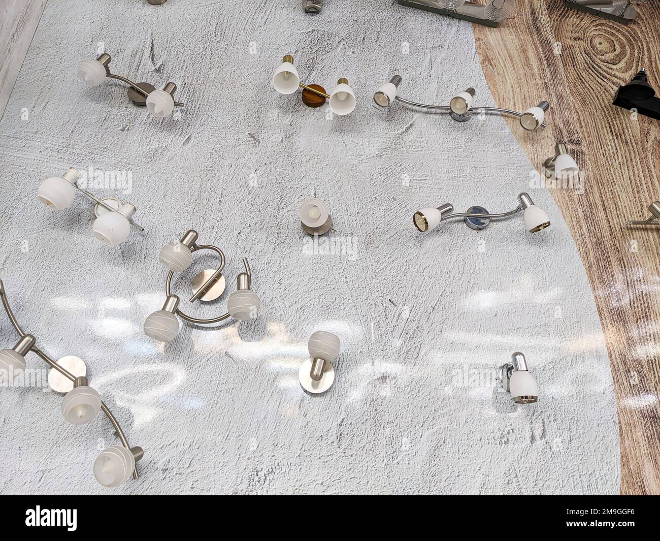 Lots of white lamps on the wall. Electrical goods, chandeliers ...