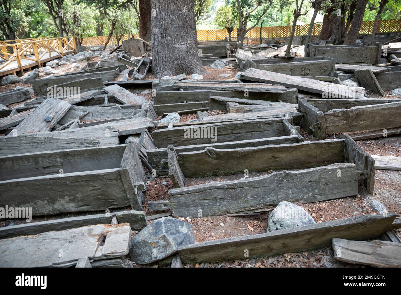 A Kalash traditional cemetery with open wooden tombs, Bumburet Valley ...