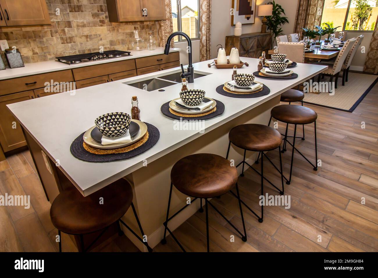 Kitchen Island Counter Top With Five Place Settings Stock Photo - Alamy