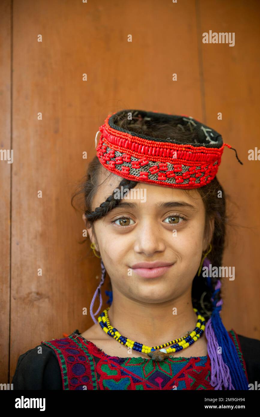 Portrait of a Kalash girl with colorful traditional headdress, Bumburet ...