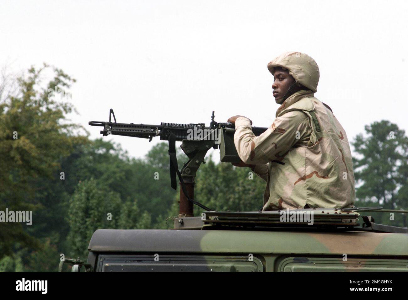 A 20th Security Forces Squadron member sits in the turret of a M998 ...