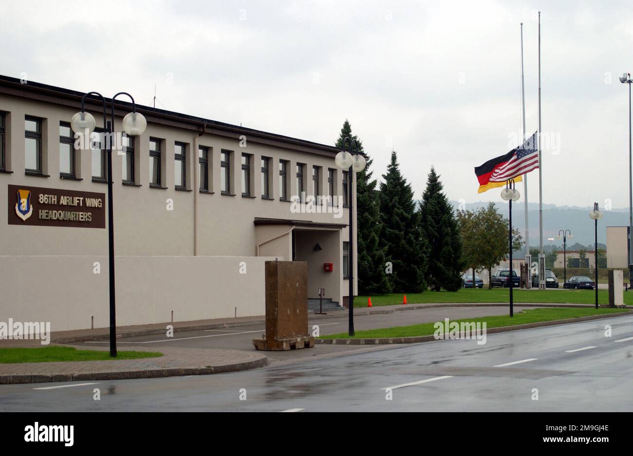 German and American Flags fly at half-staff outside Wing Headquarters ...