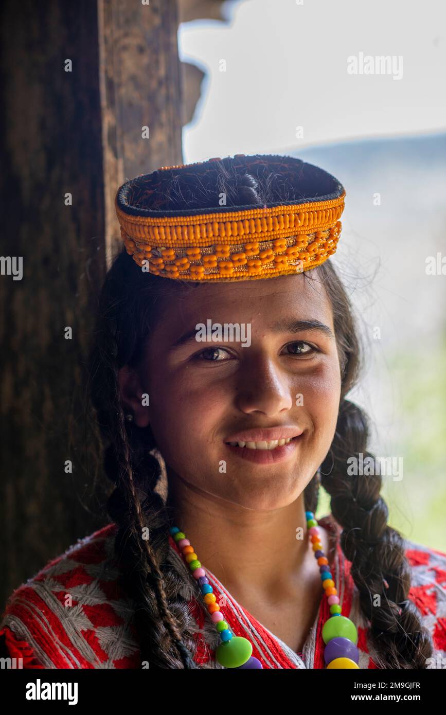 Portrait of a Kalash girl with colorful traditional headdress, Bumburet ...