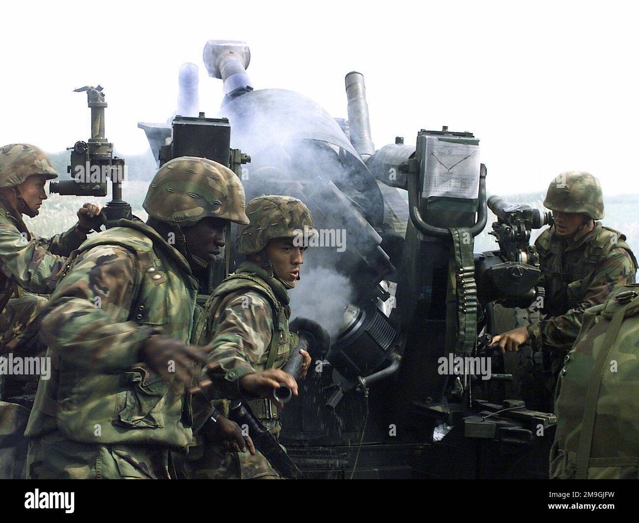 STAFF Sergeant (SSGT) William Diaz (right), Gun CHIEF, instructs his ...